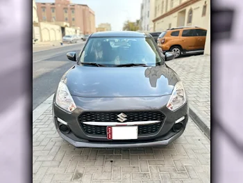 Suzuki Swift Grey Hatchback For Rent in Qatar