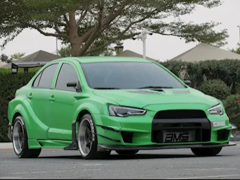 Mitsubishi Lancer Evolution Green 2009 For Sale in Qatar