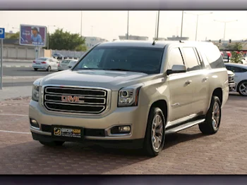 GMC Yukon XL Gold 2015 For Sale in Qatar